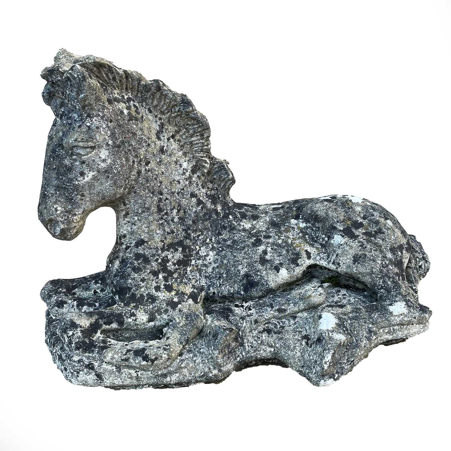 Lot 615 - A cast concrete figure of a recumbent foal,