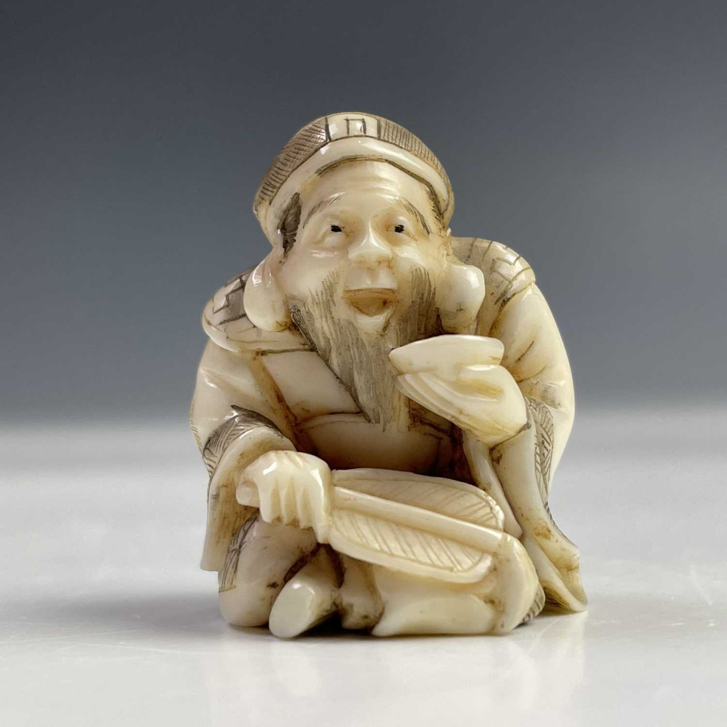 Lot 563 - A Japanese ivory netsuke, Meiji period,