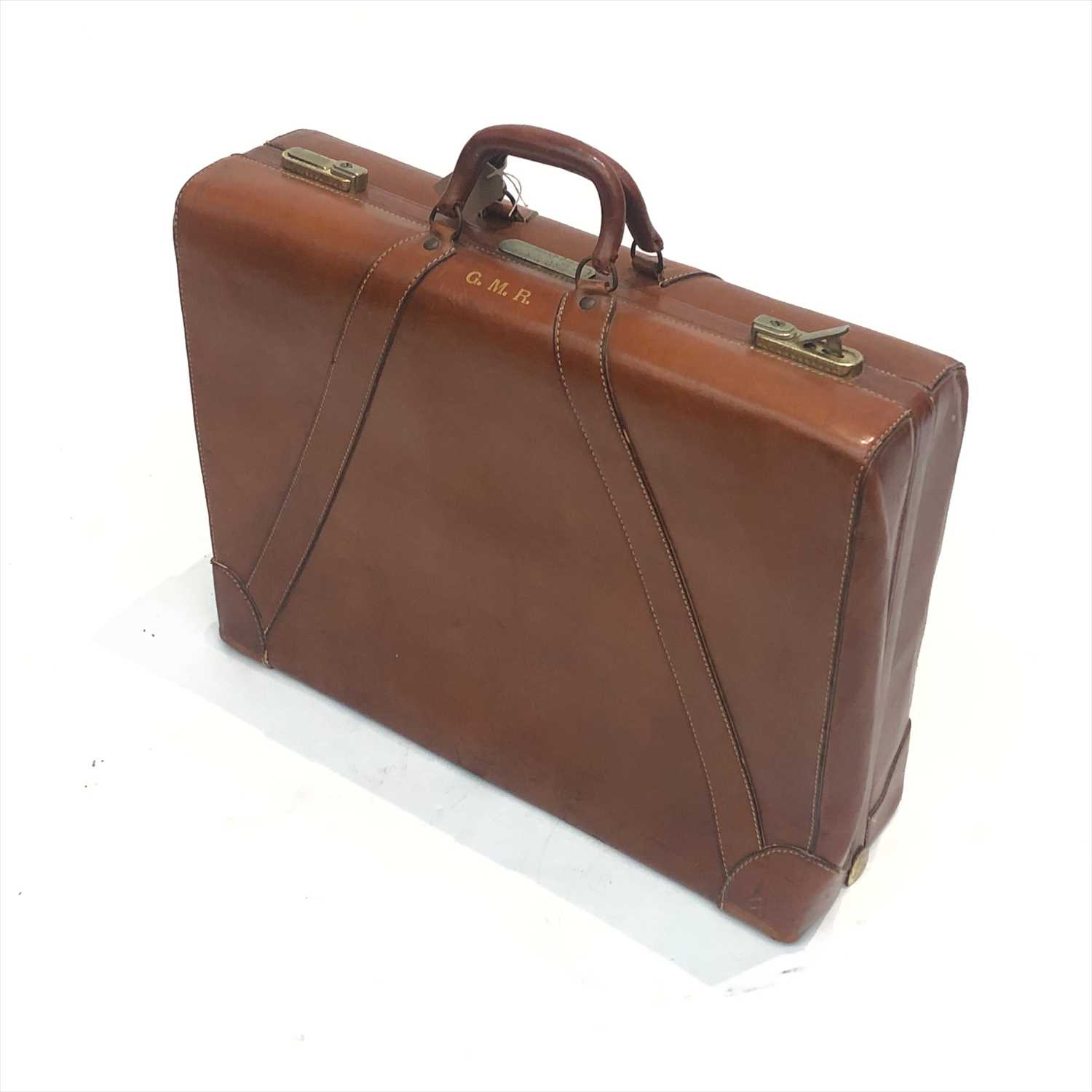 Lot 3011 - A vintage tan leather suitcase, monogrammed