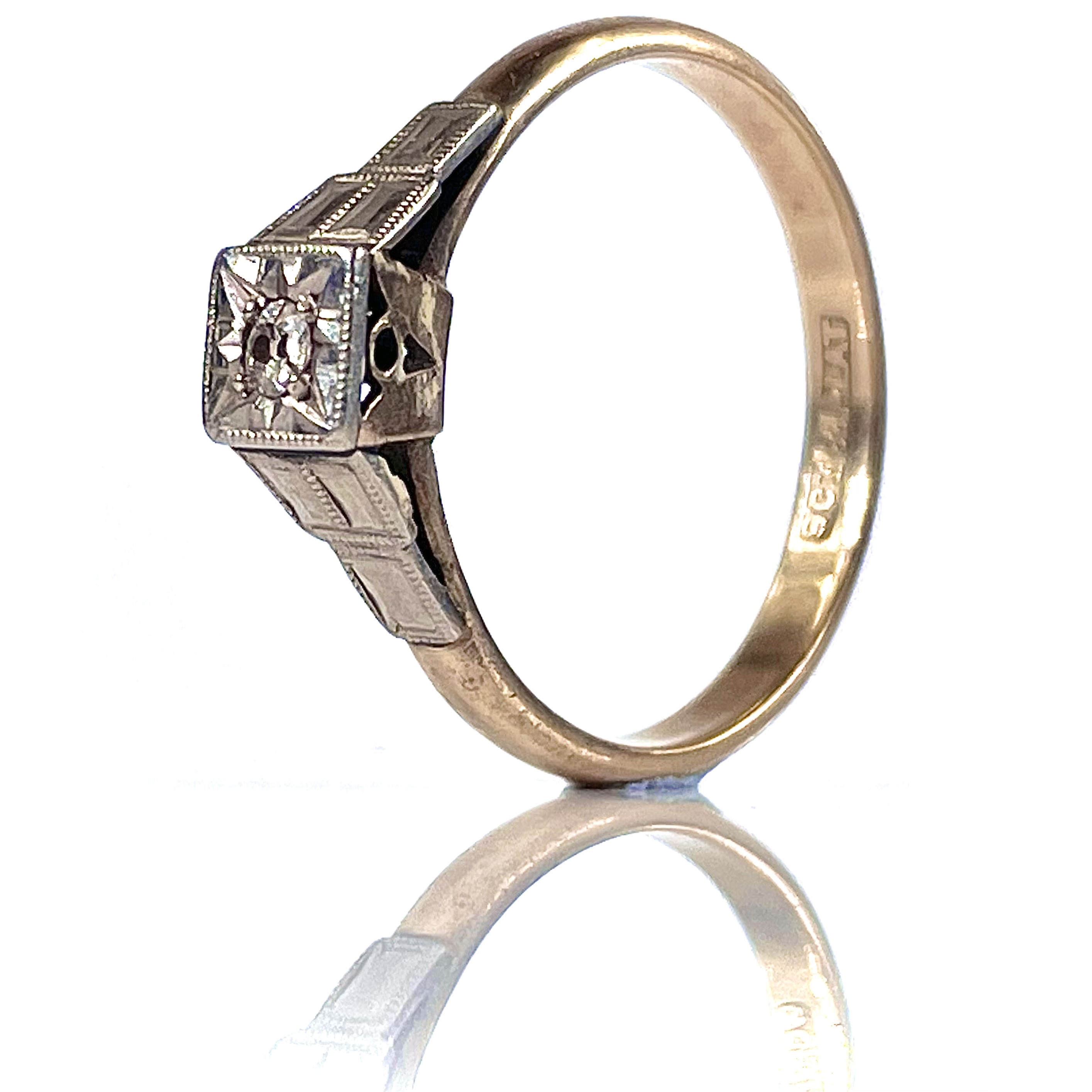 Lot 35 - A 9ct and platinum single small diamond set
