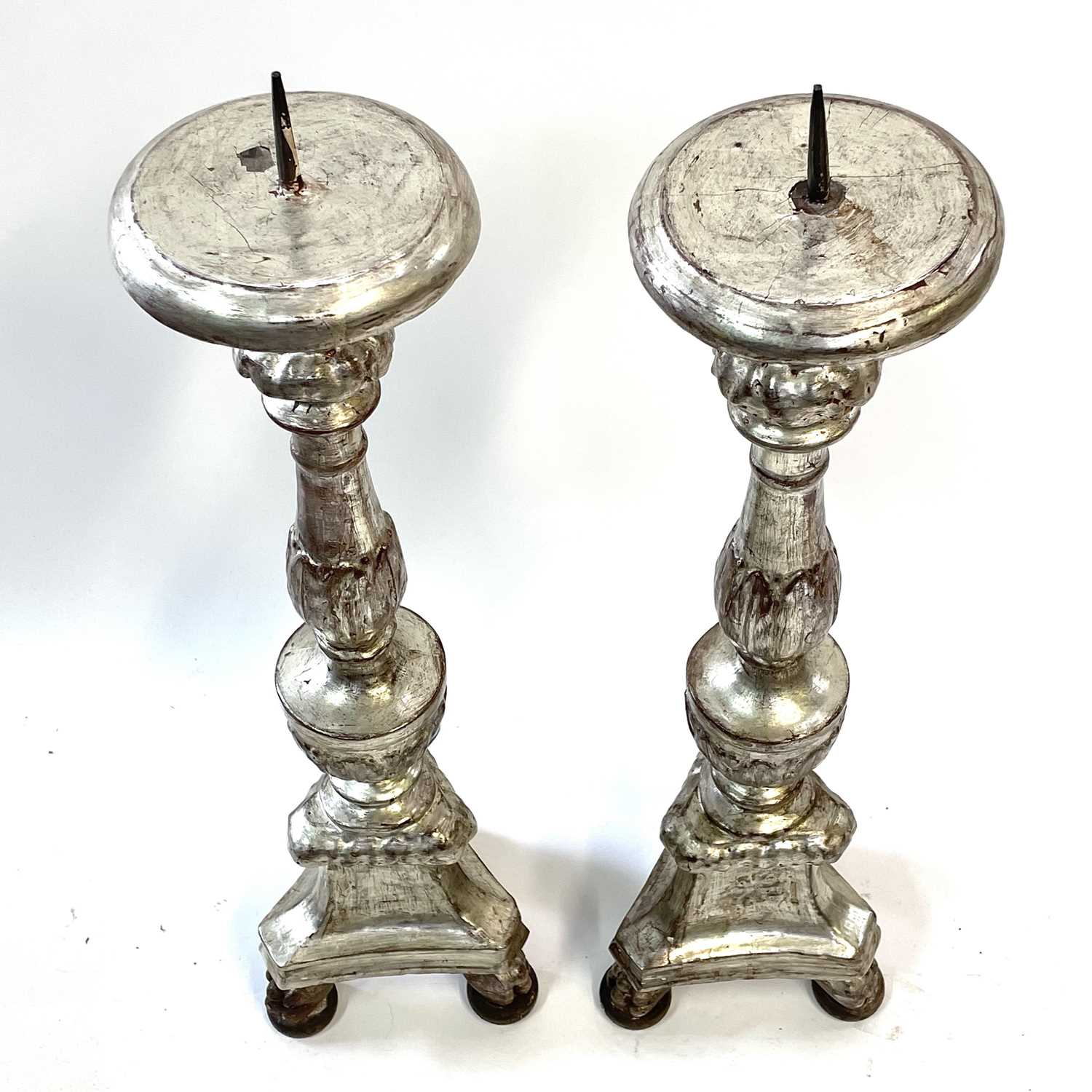 Lot 22 - A pair of Italian silvered carved wood candle