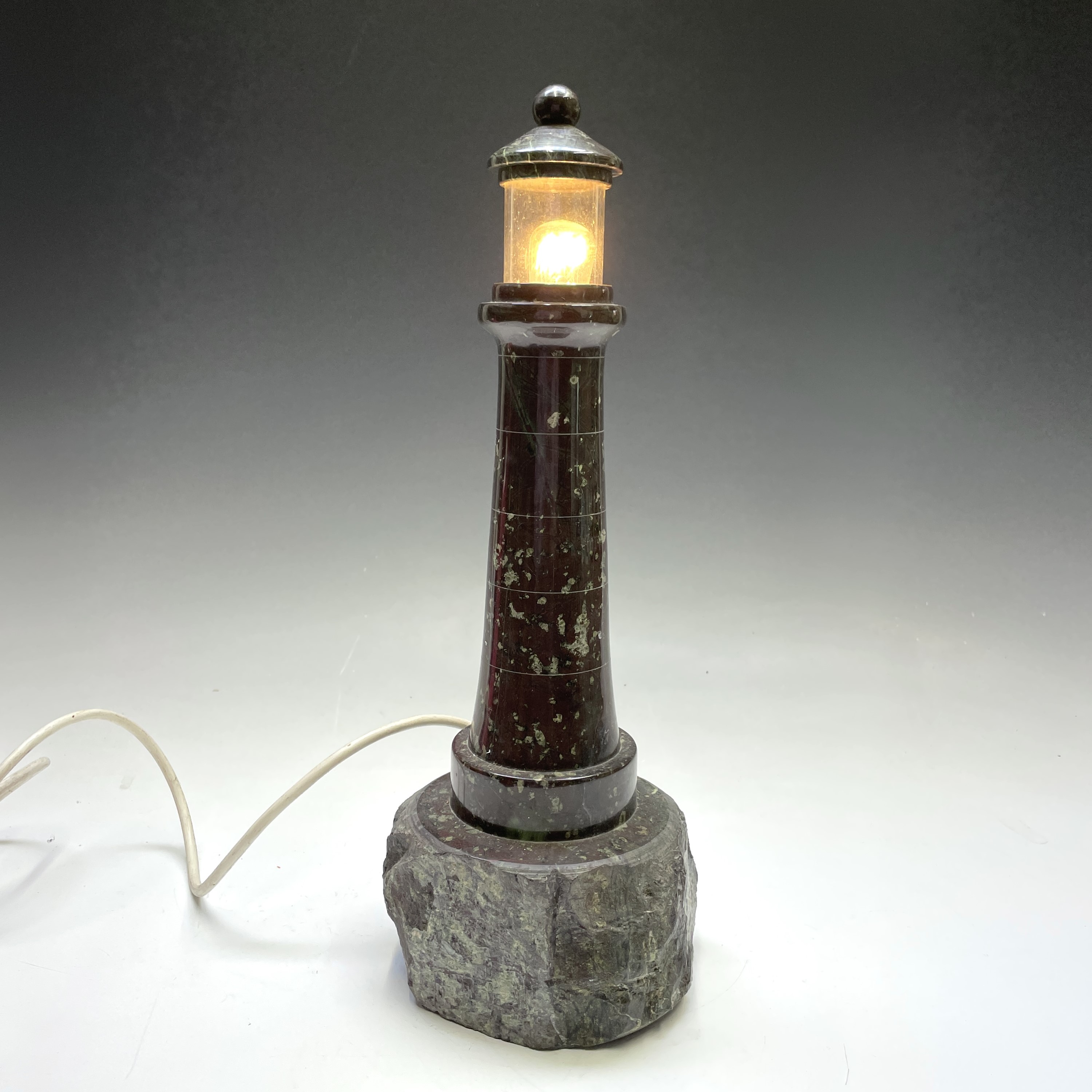 Lot 82 - A Cornish serpentine turned lighthouse lamp,