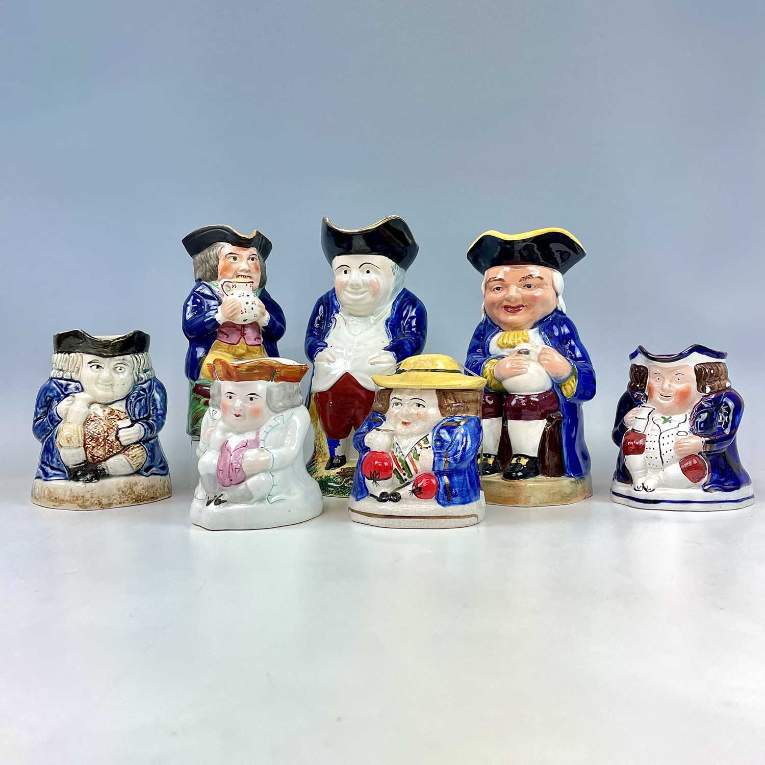 Lot 970 - A late Victorian Staffordshire Toby jug,