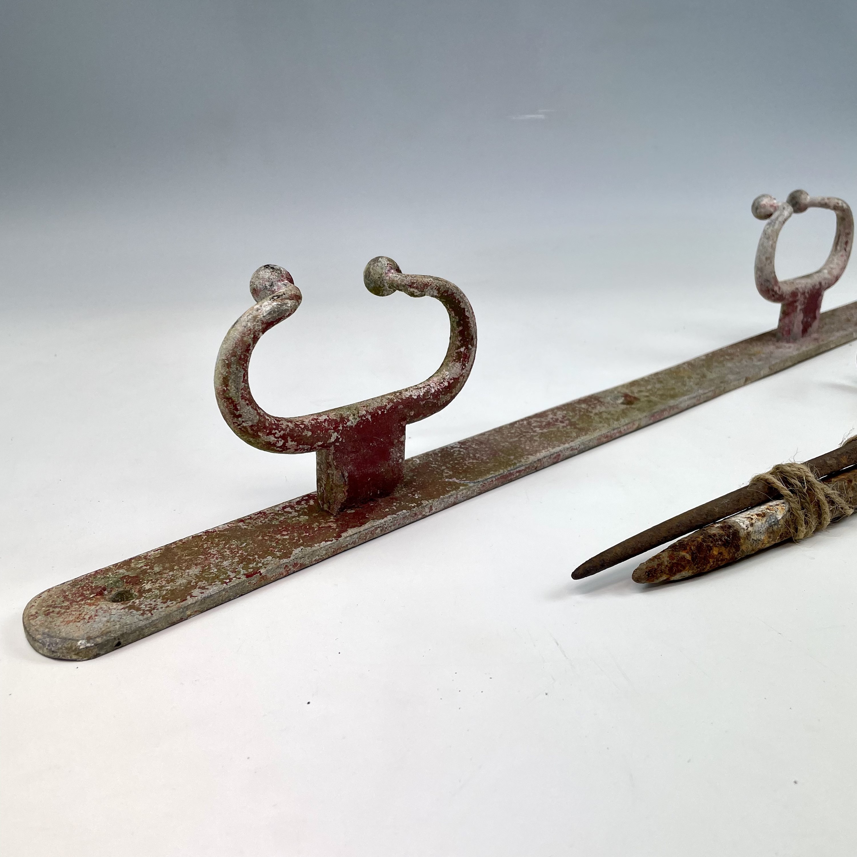 Lot 104 - A wrought iron garden string line and winder,