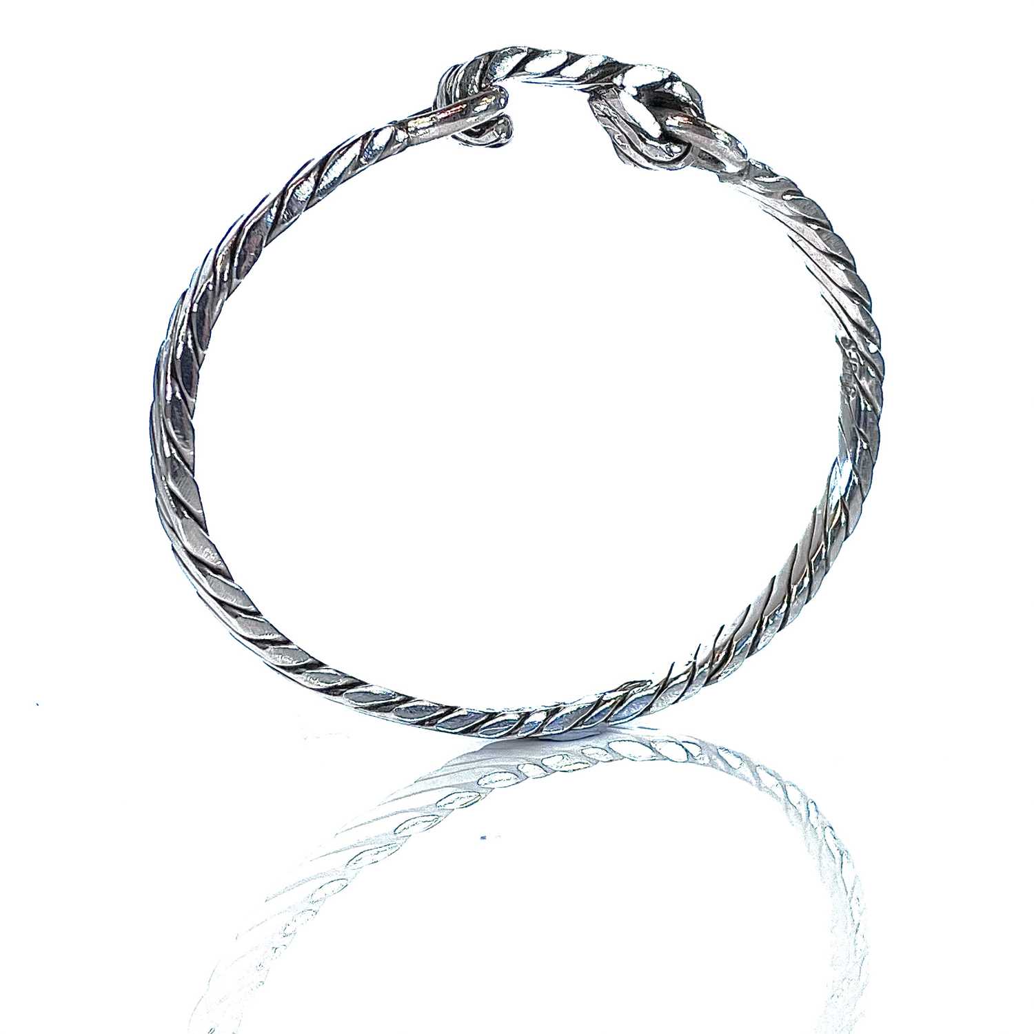 Lot 285 - A 999 fine silver Newlyn Rope bangle by