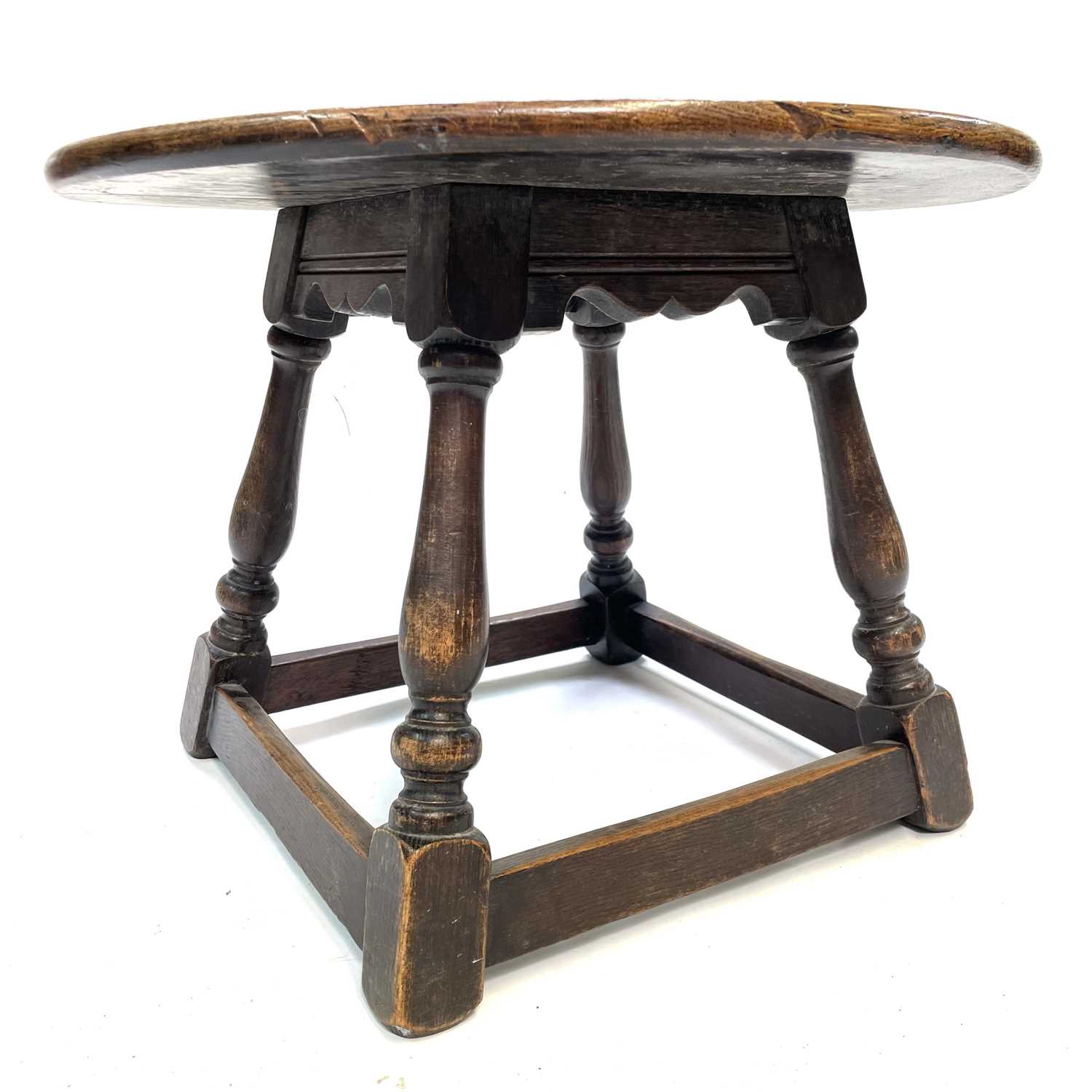 Lot 61 - An oak circular low table, circa 1920's.