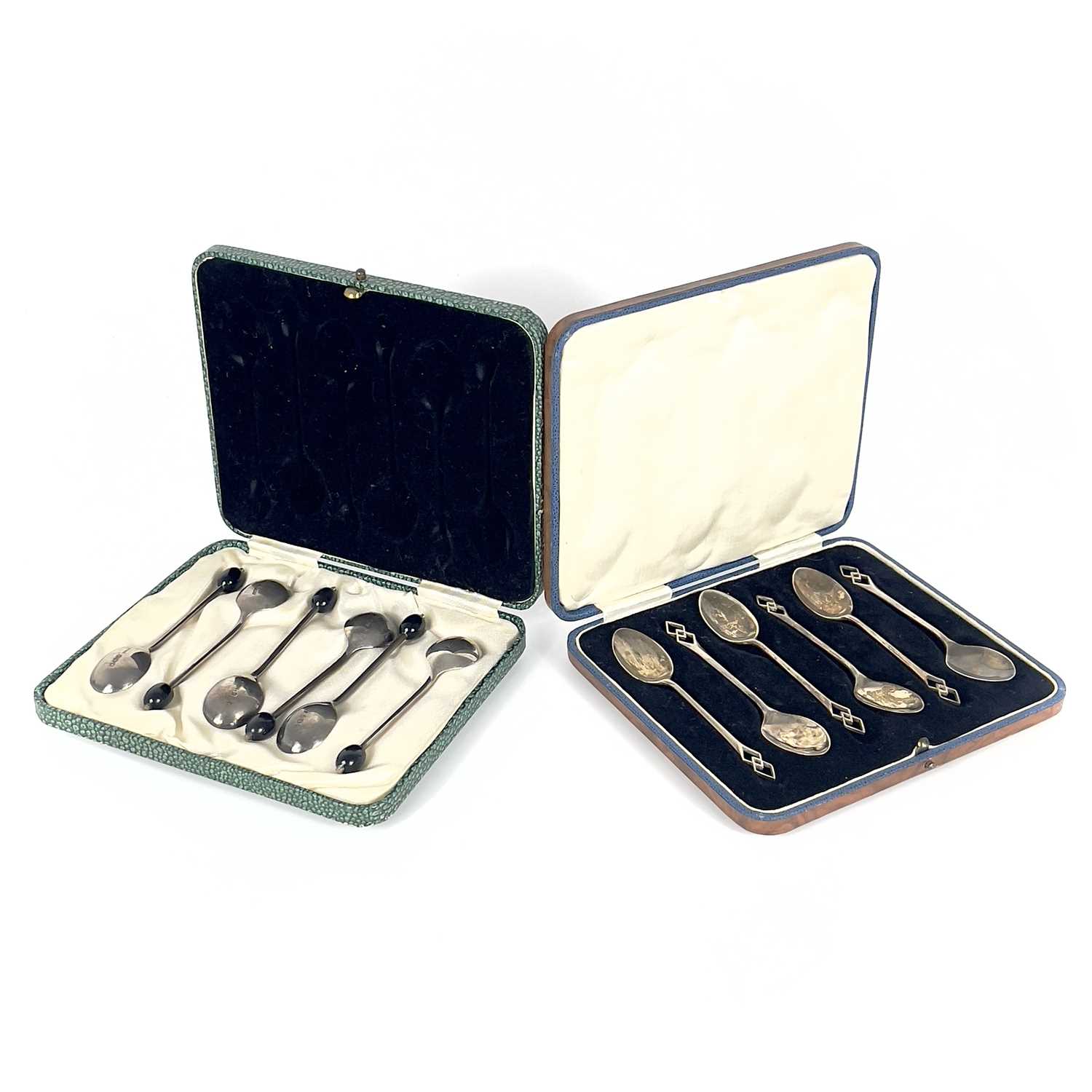 Lot 182 - Two silver demi-tasse spoon sets,