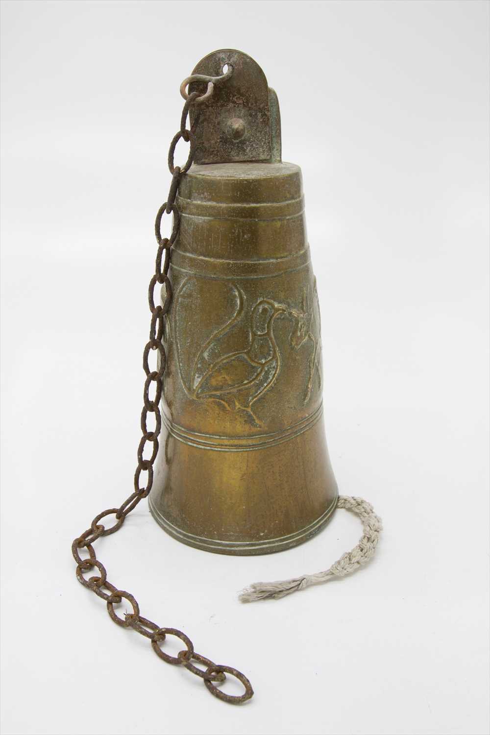 Lot 210 - A Middle Eastern heavy brass bell decorated