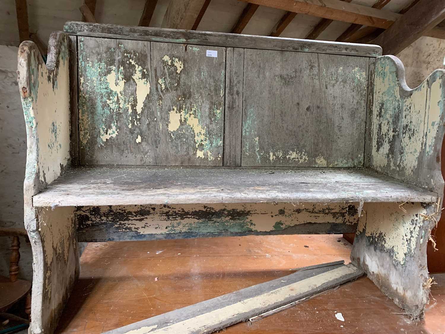 Lot 423 - A painted wooden settle.