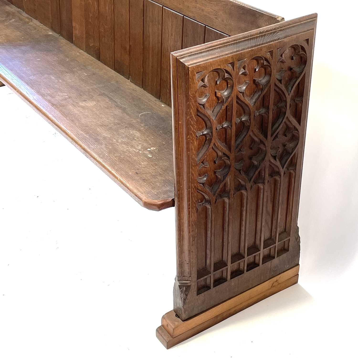Lot 49 - A Gothic oak church pew, 19th century.