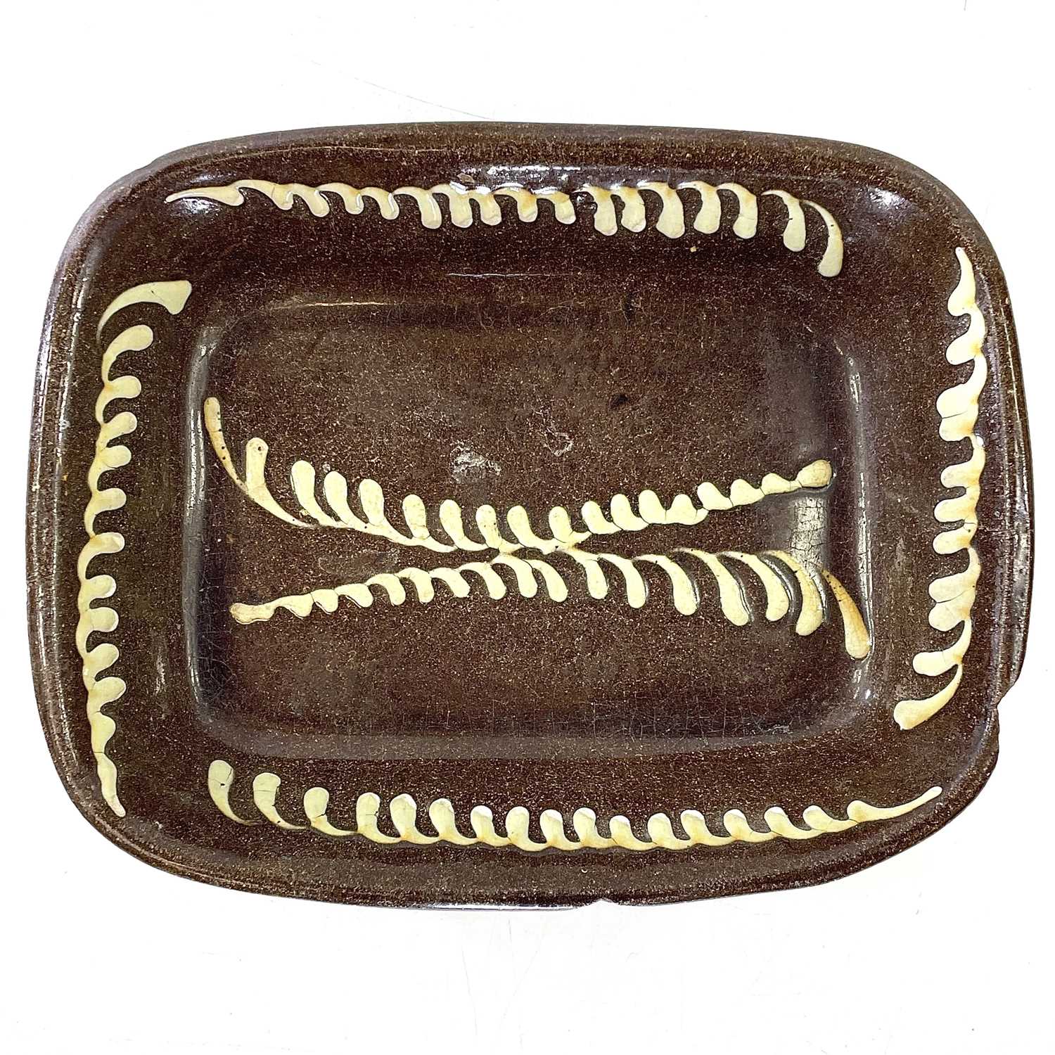 Lot 68 - A Slipware baking dish, mid 19th century.