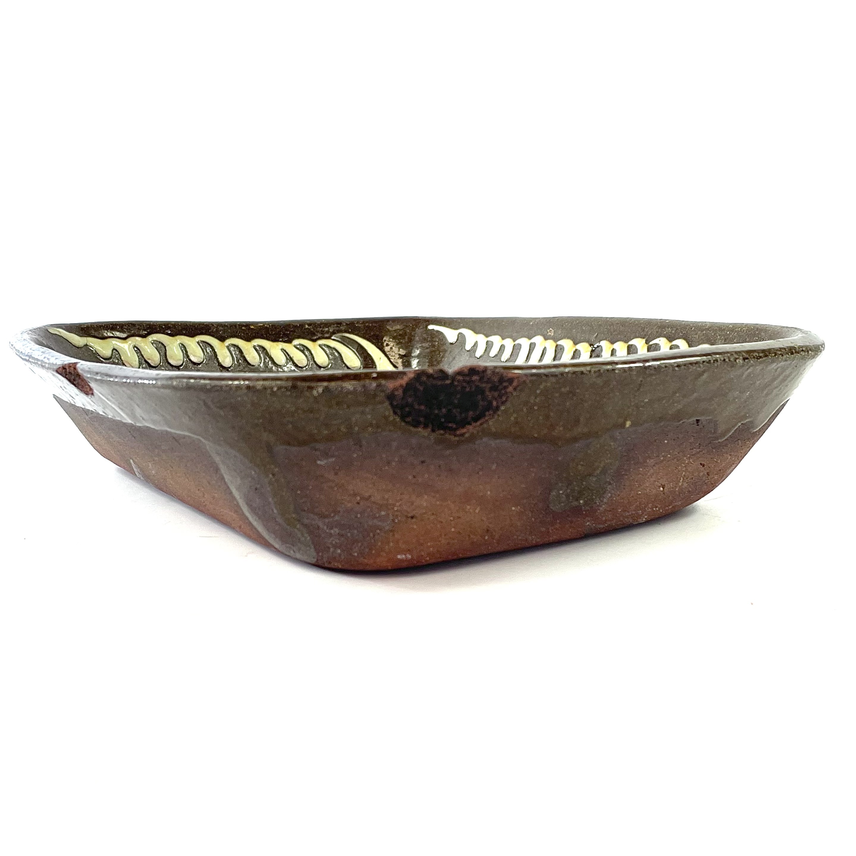 Lot 68 - A Slipware baking dish, mid 19th century.
