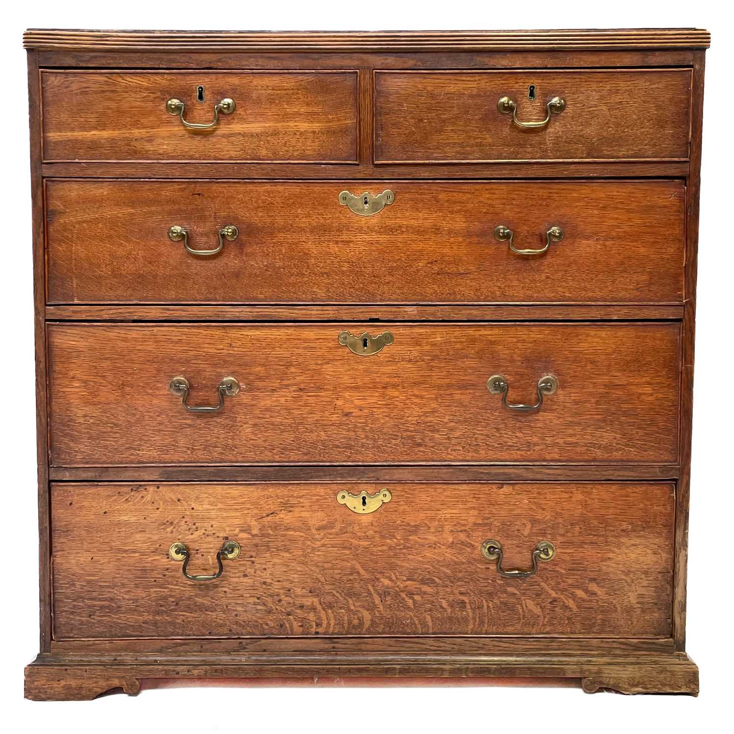 Lot 75 - A George III oak chest of drawers.