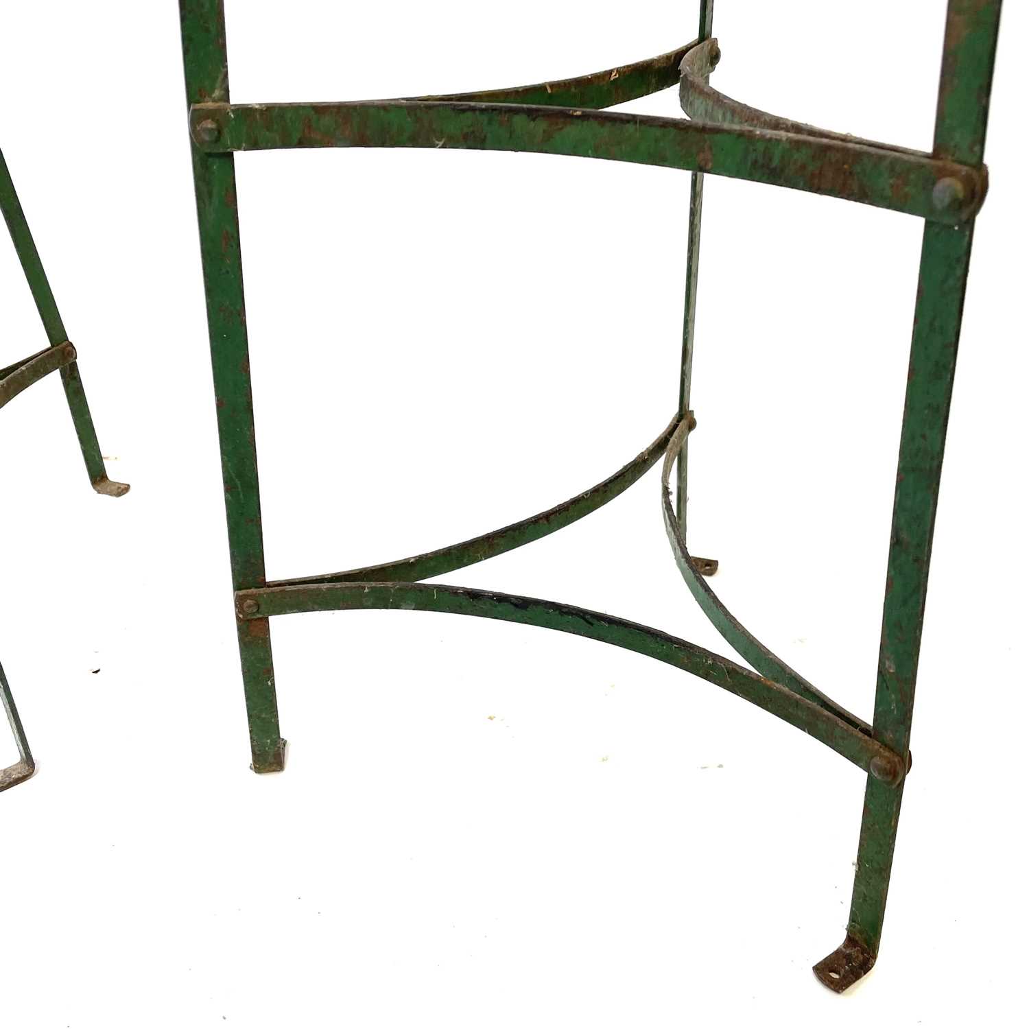 Lot 157 - Two wrought iron green-painted triangular