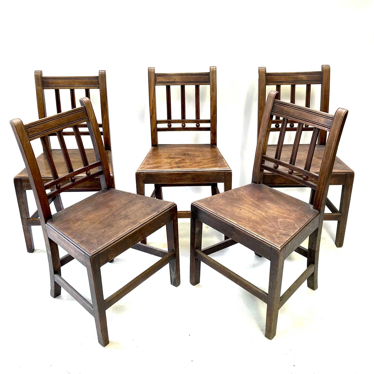 Lot 176 - A set of five George III fruitwood and elm