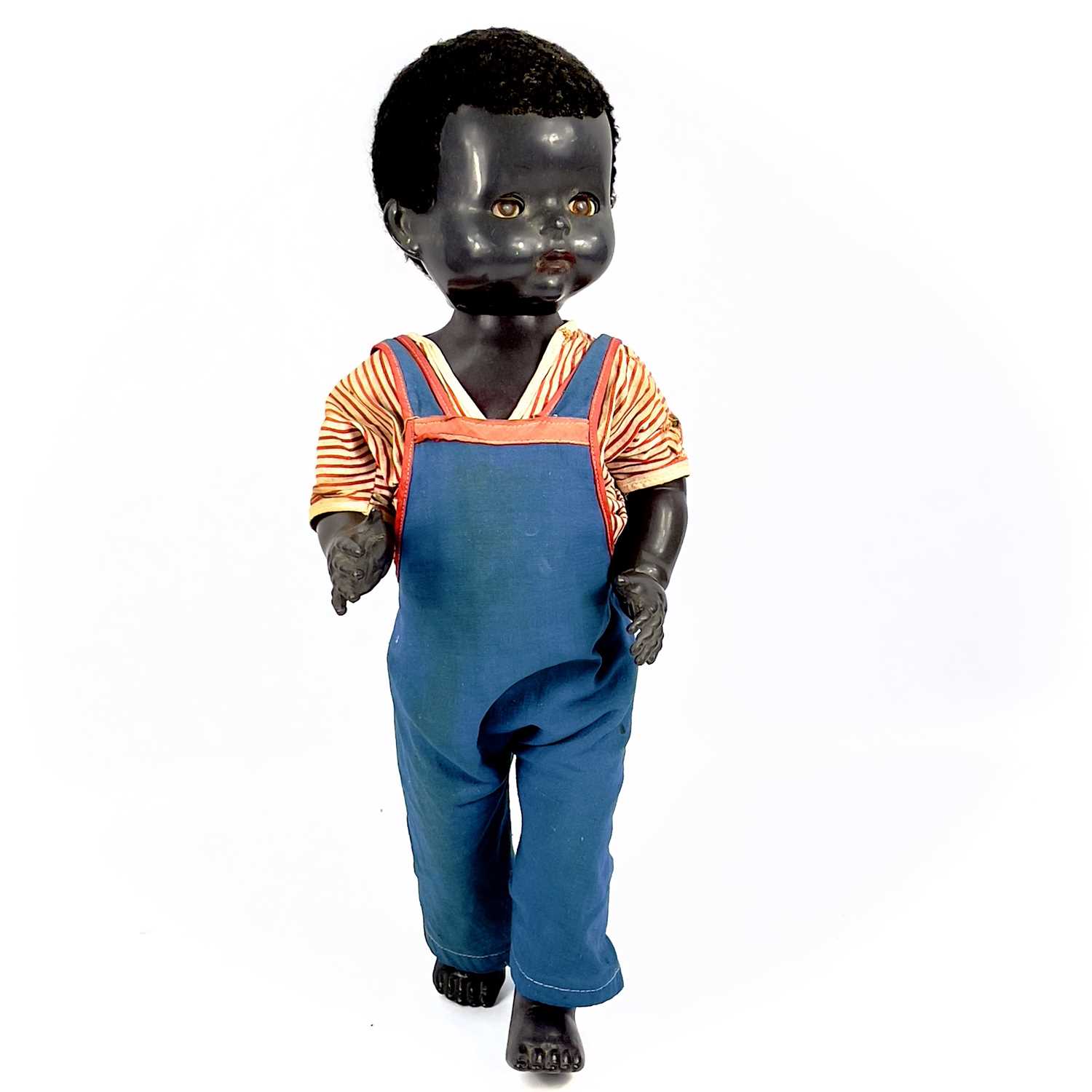 Lot 757 - A Black Celluloid Mechanical Walking,