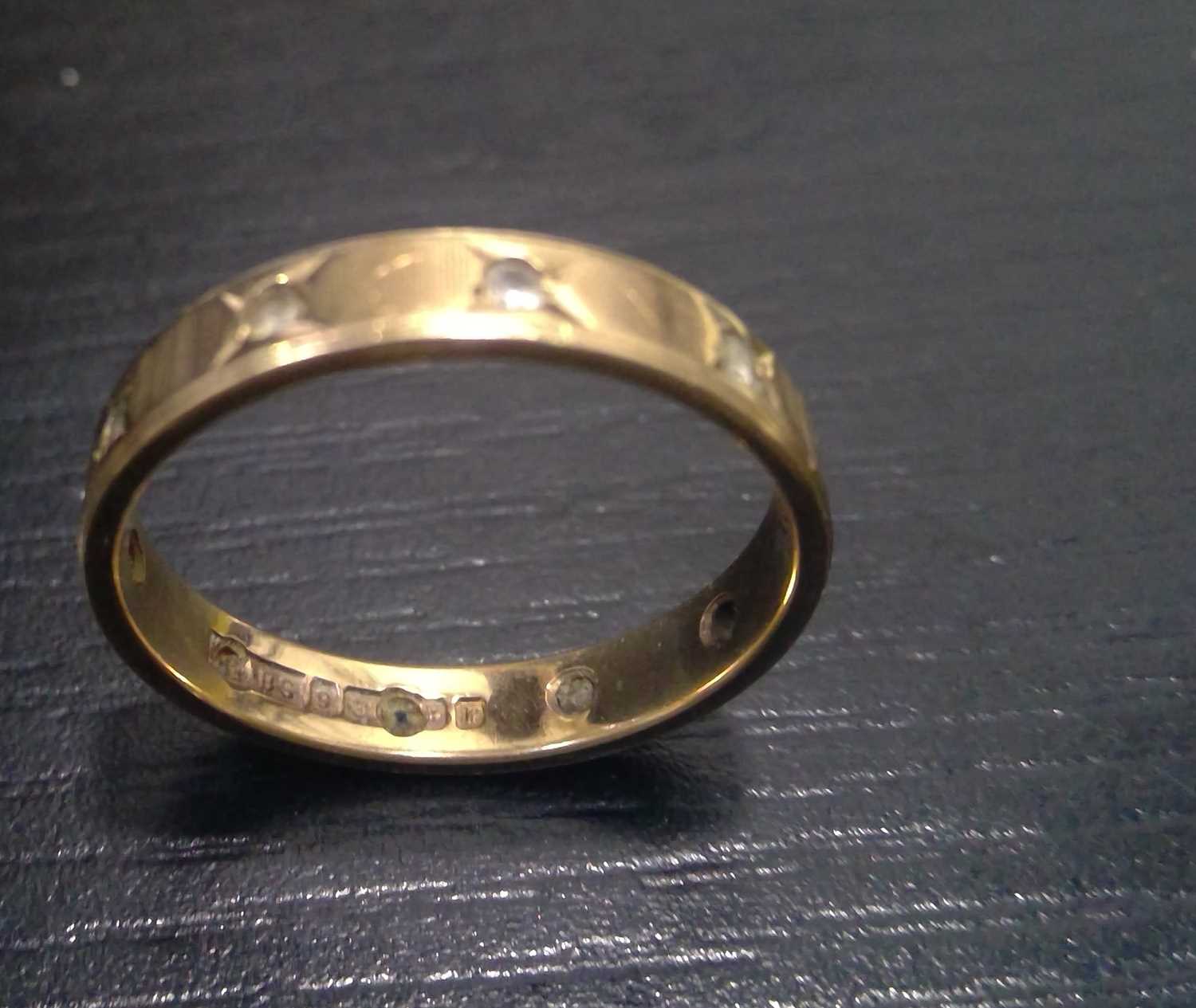 Lot 3 - A 9ct Gold, Wedding Band. With inset Stones,
