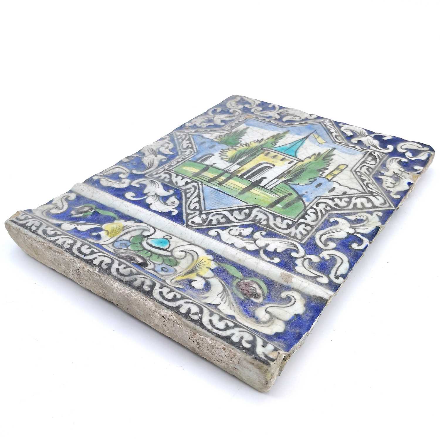 Lot 1018 - A large Persian polychrome pottery tile,