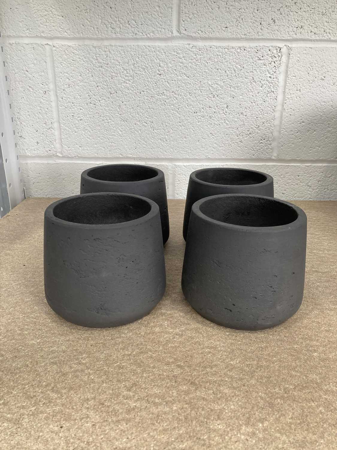 Lot 278 - Four Stratton Tapered Pots in Carbon. Height: