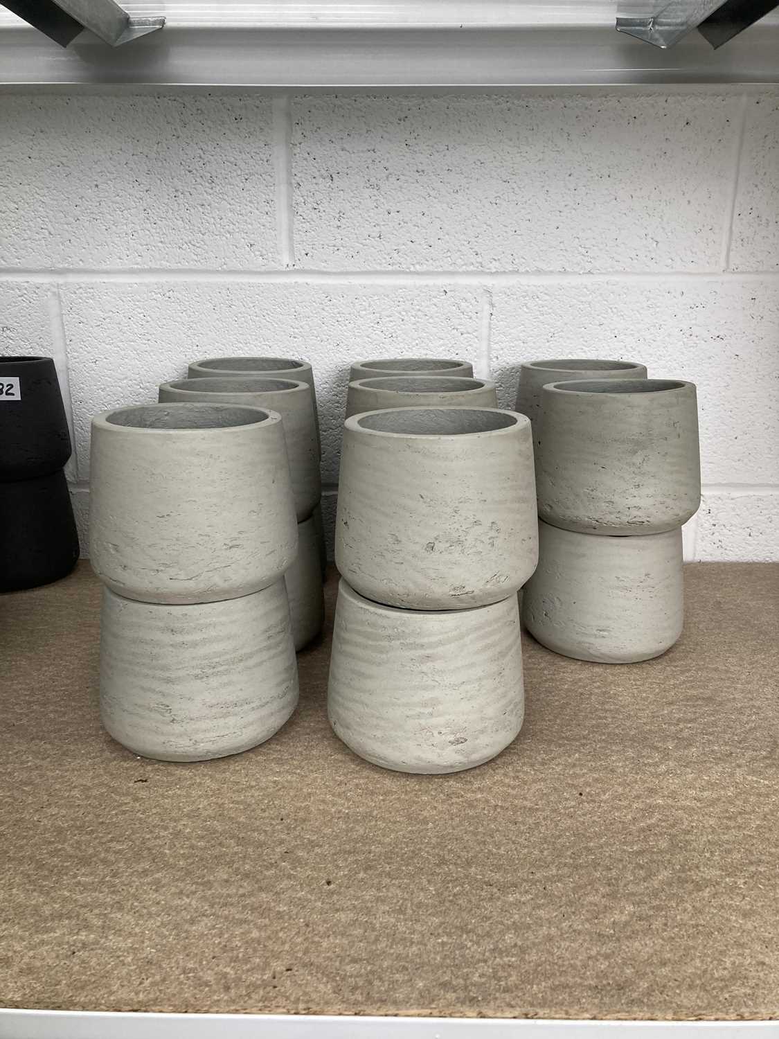 Lot 280 - Sixteen Stratton Tapered Pots in Stone.