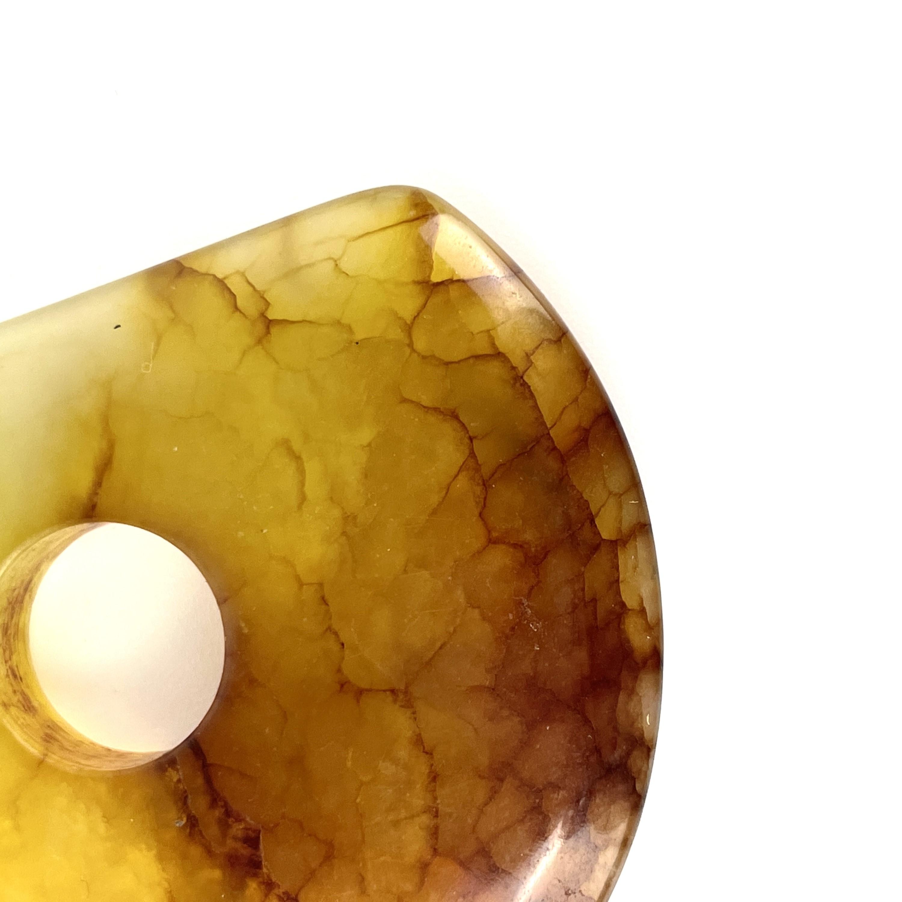 Lot 21 - A Chinese russet jade pendant, Qing Dynasty.