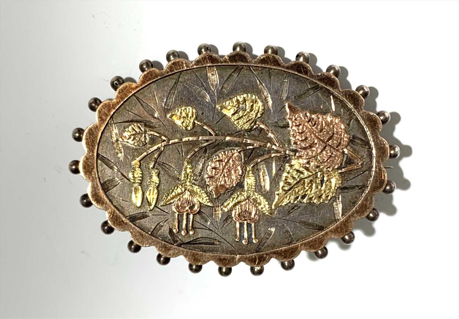Lot 2494 - A Victorian silver brooch with applied