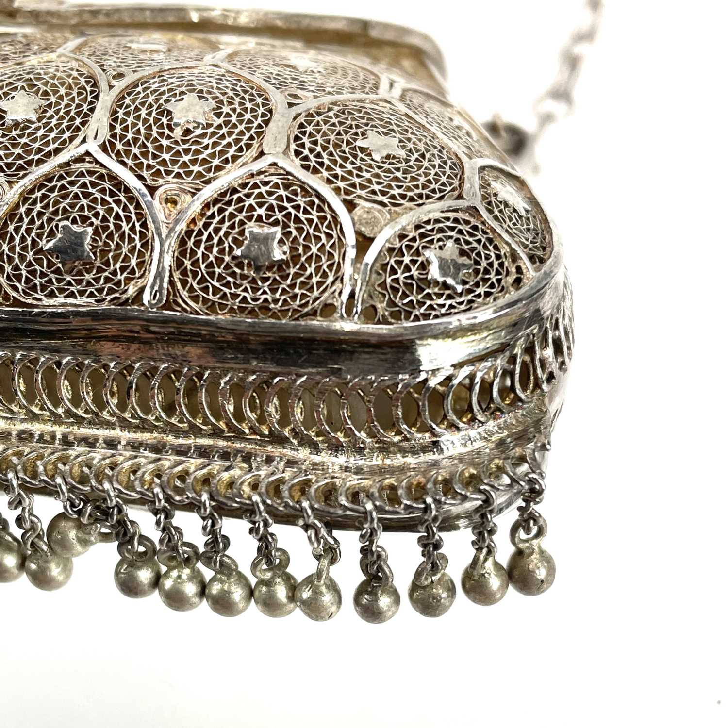 Lot 1045 - An Indian silver filigree purse.