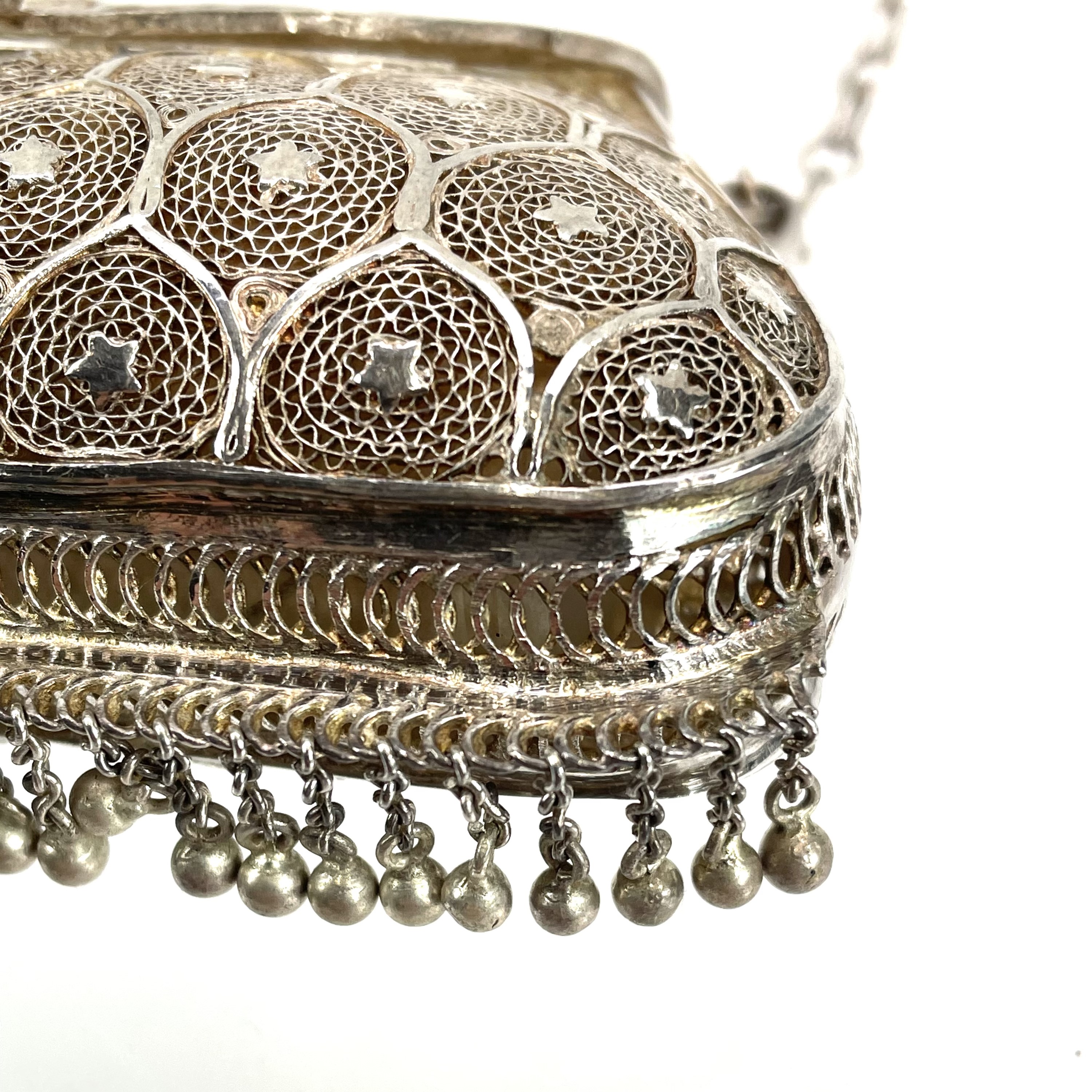 Lot 1045 - An Indian silver filigree purse.