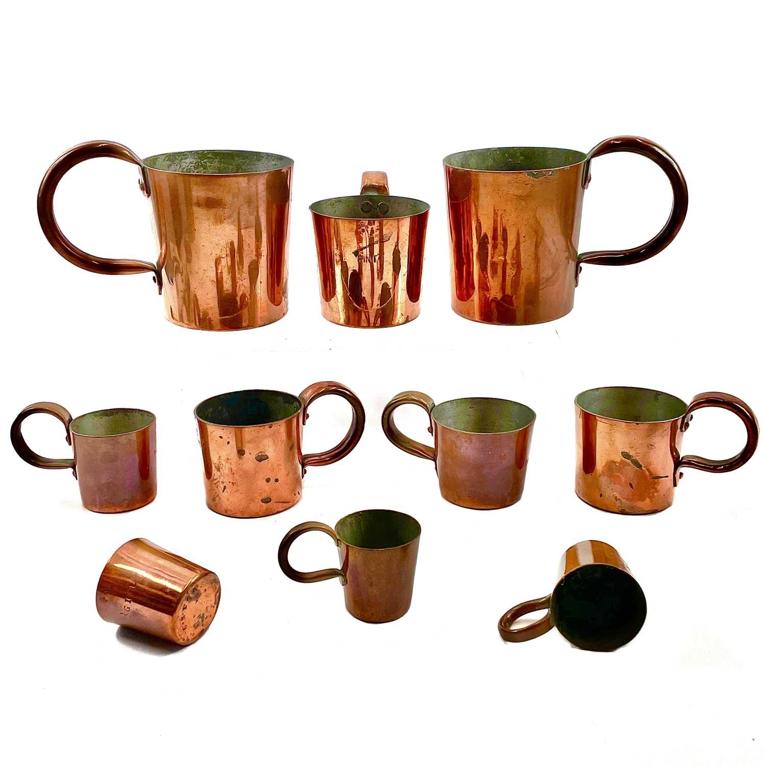 Lot 76 - A group of ten Naval copper rum or grog