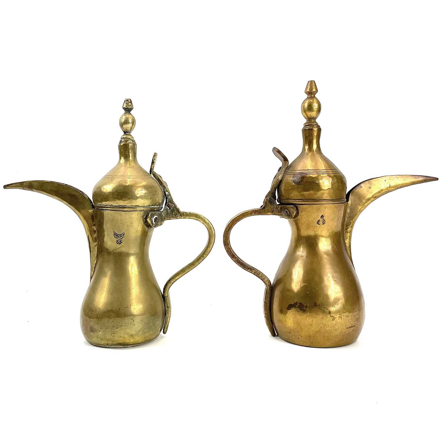 Lot 1064 - A late 19th century brass dallah pot,