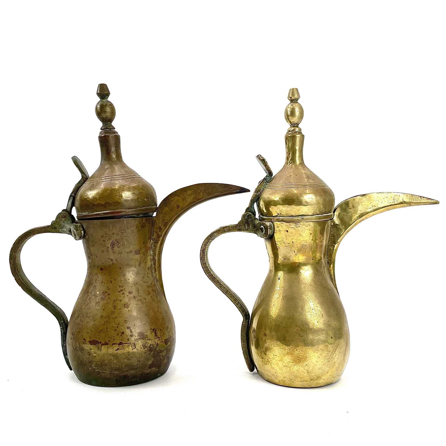 Lot 1065 - A late 19th century brass dallah pot, with