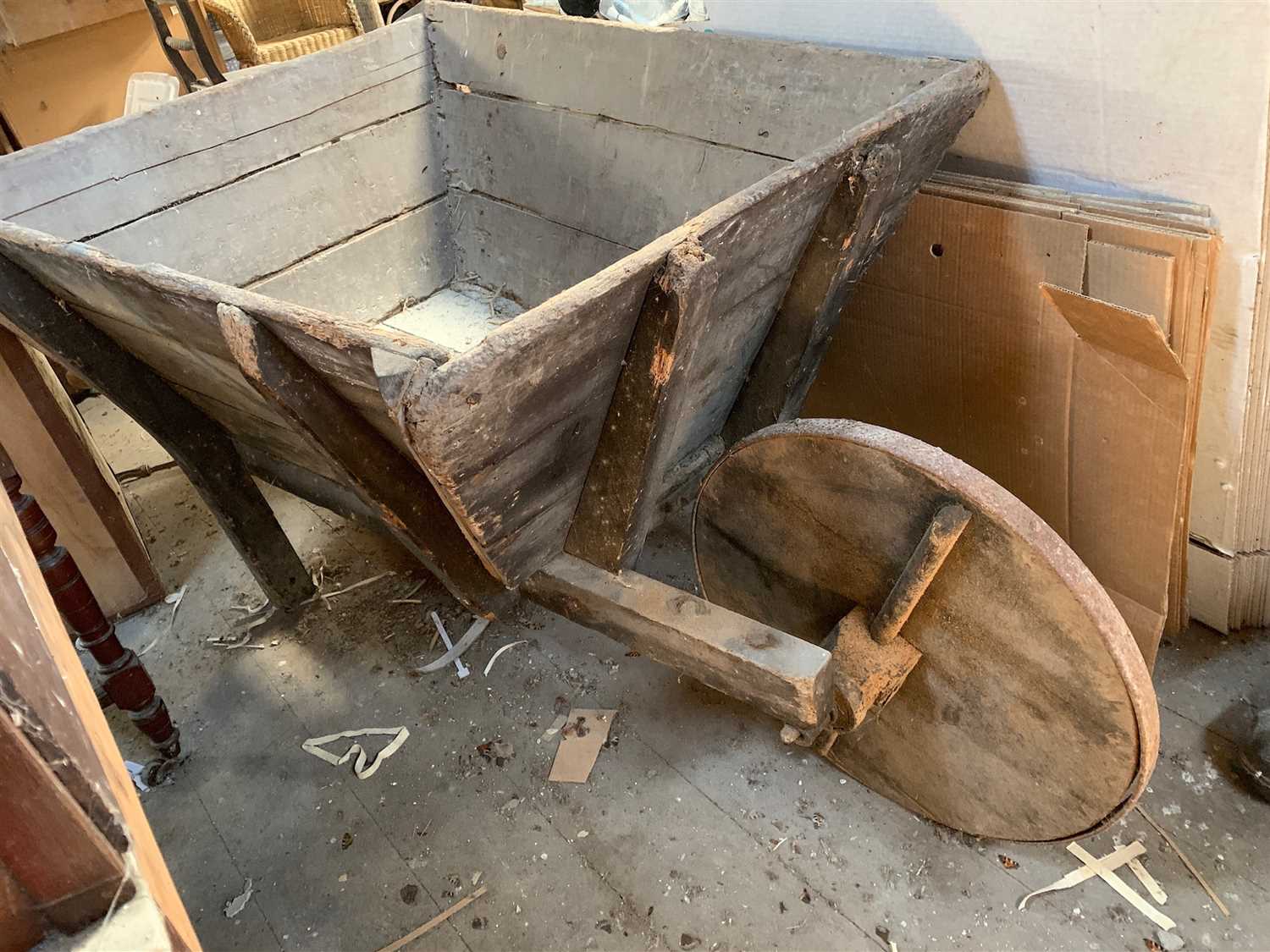 Lot 429 - A massive wooden wheelbarrow with solid