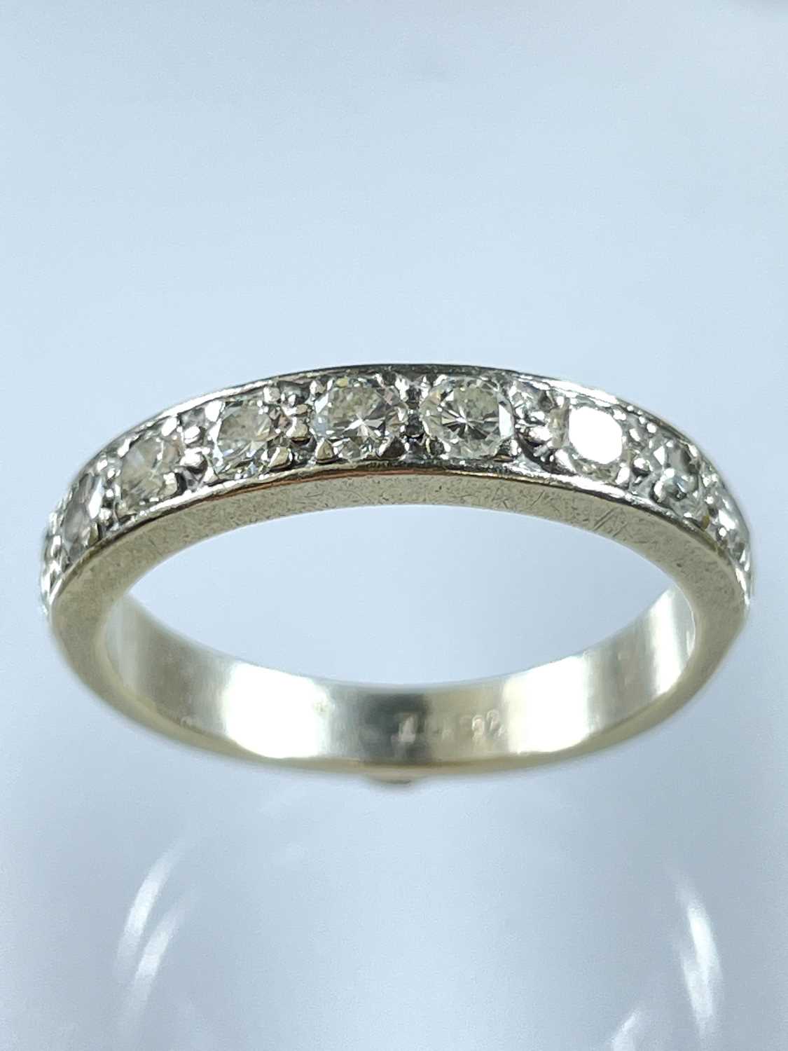 Lot 231 - An 18ct white gold diamond set nine stone