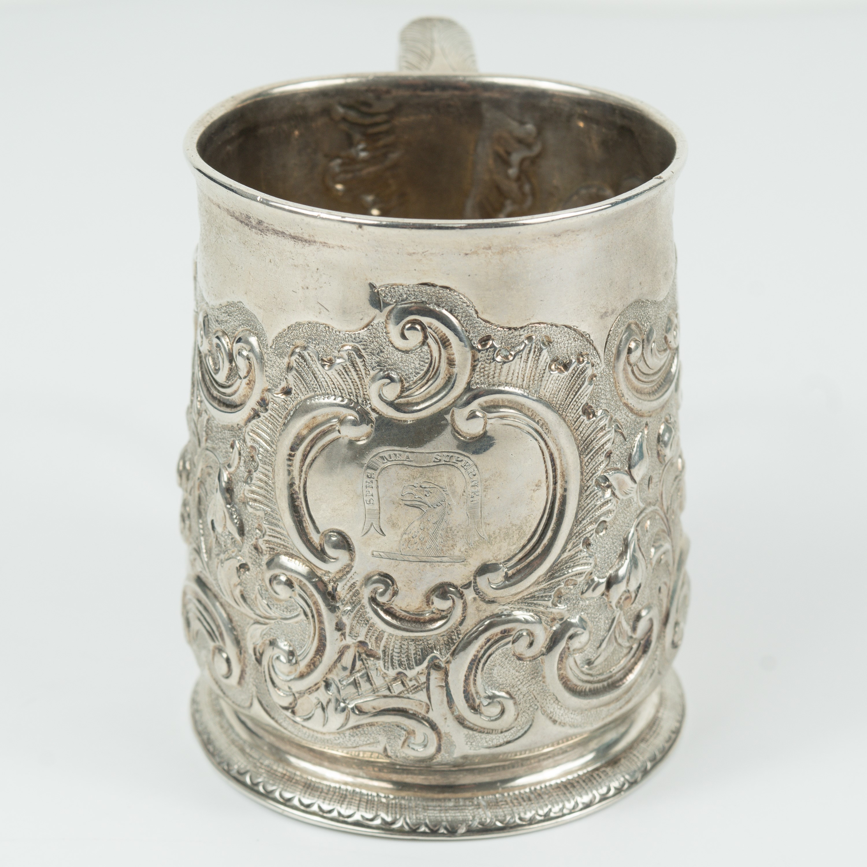 Lot 70 - A George II silver embossed mug by William