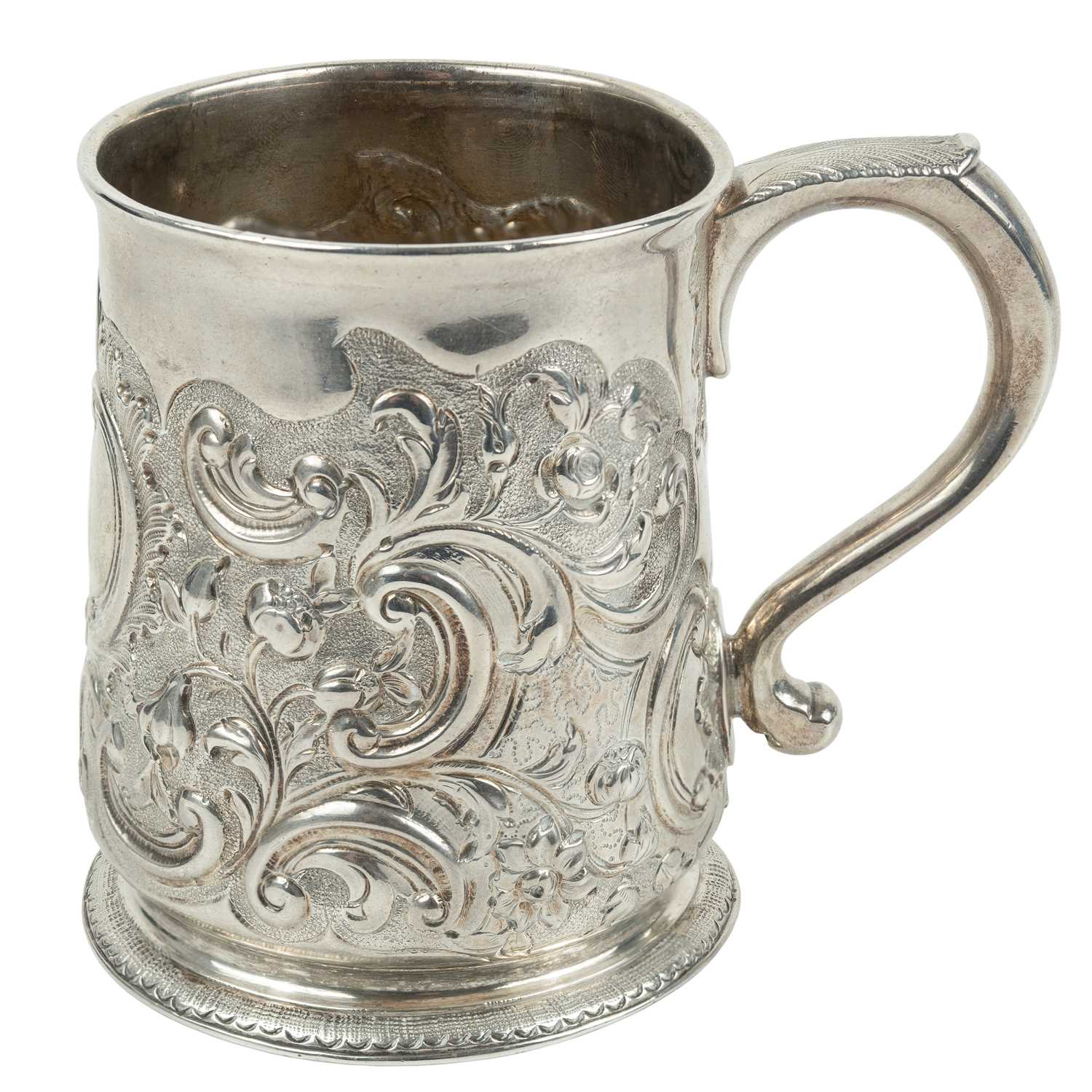 Lot 70 - A George II silver embossed mug by William
