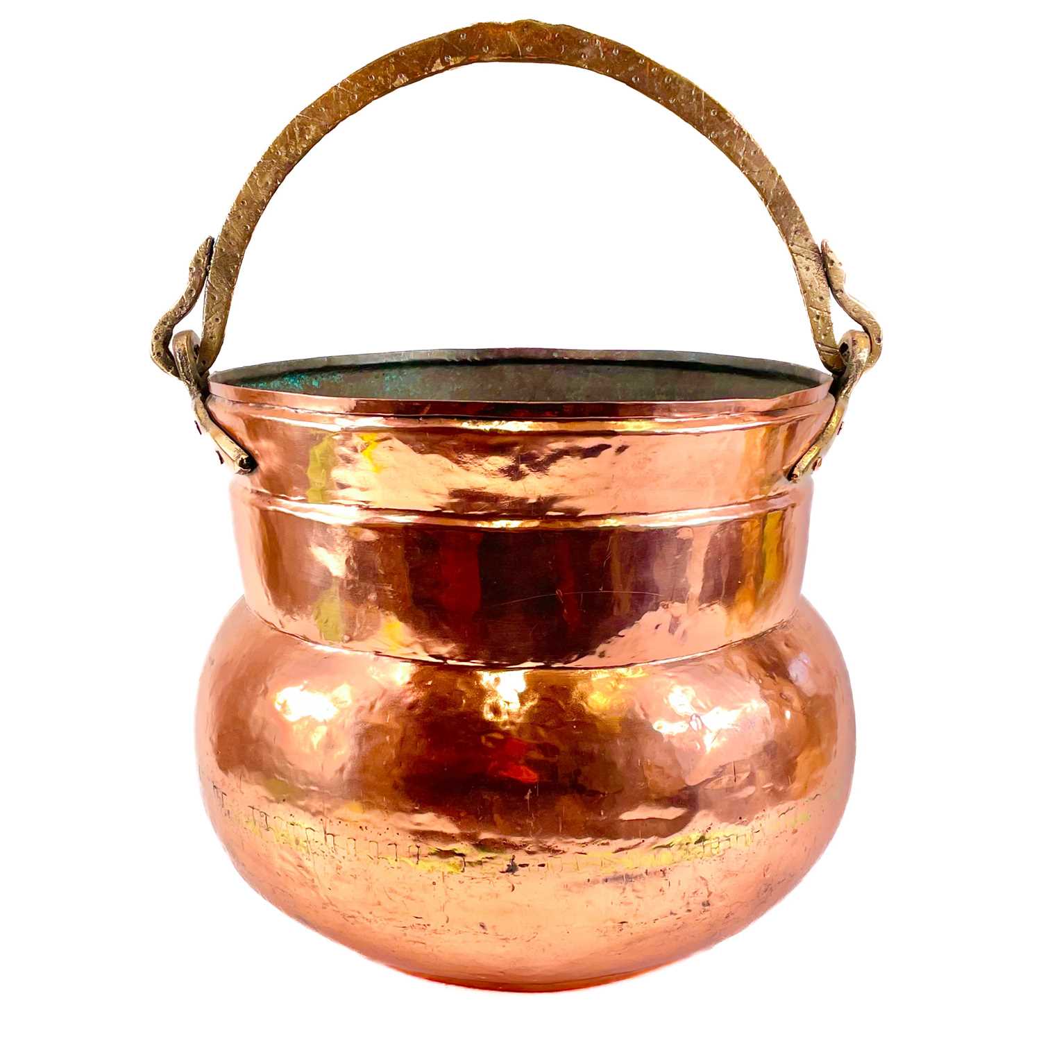 Lot 222 - A large copper cauldron with brass mounts