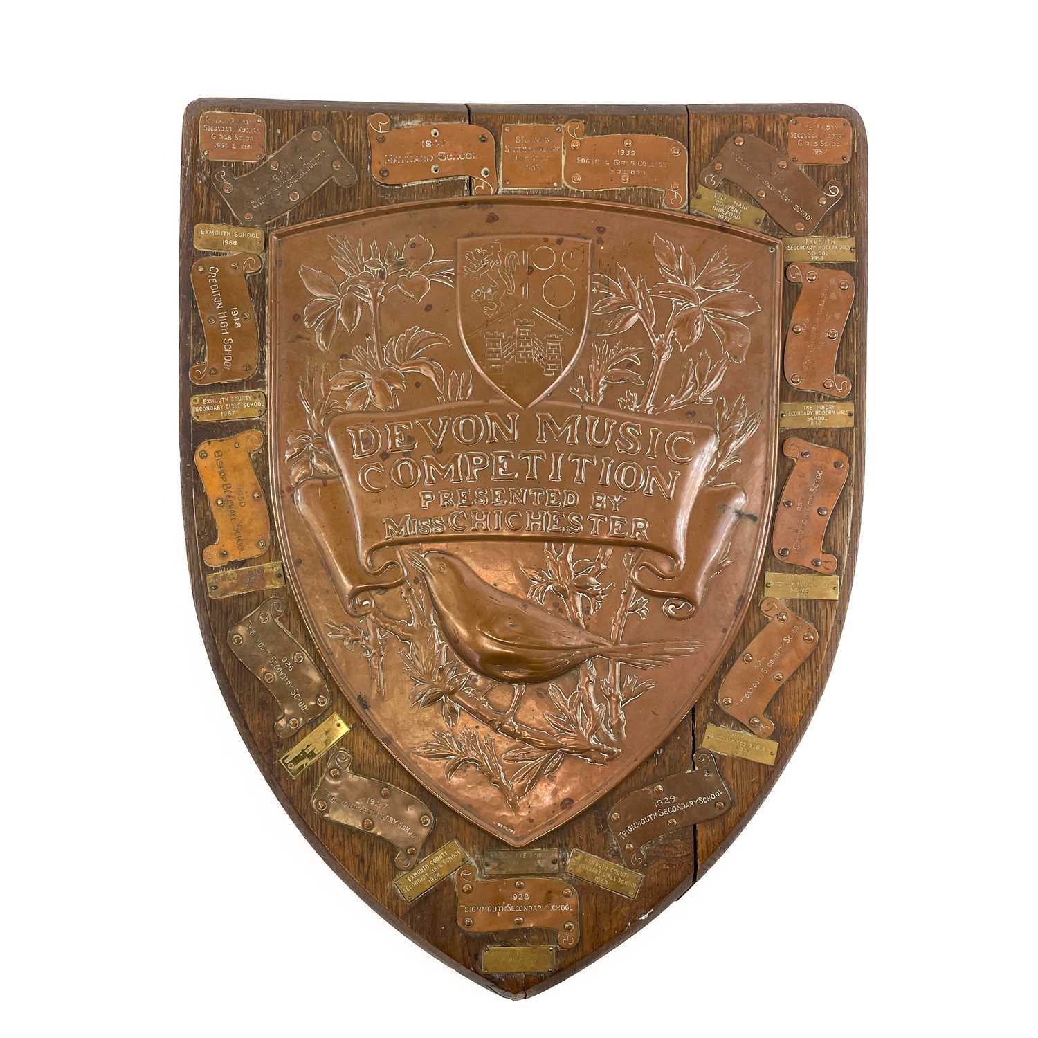 Lot 111 - A Newlyn copper shield shape Devon Music