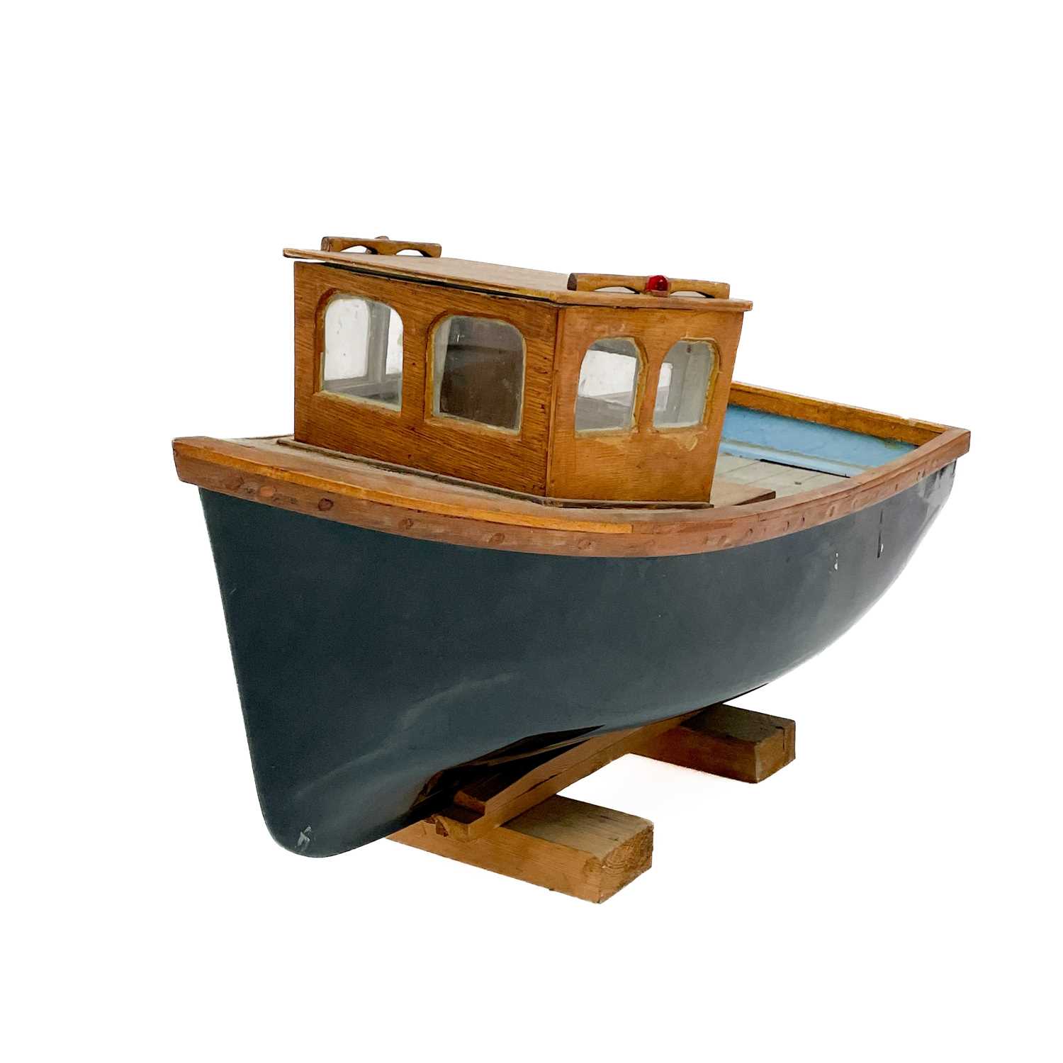 Lot 494 - A large model of a boat with fibreglass hull.