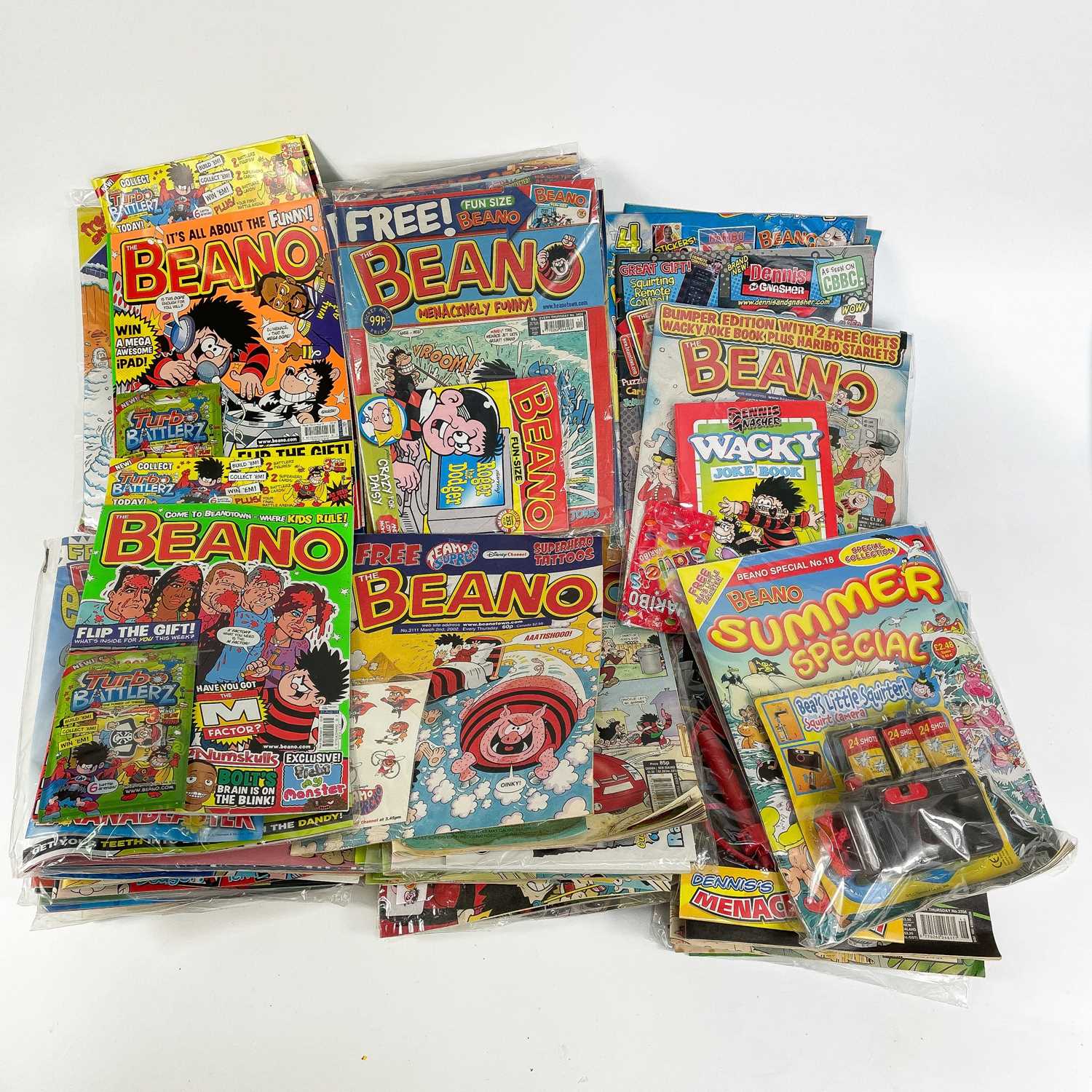 Lot 816 - Beano Comics with Special Gifts in Original