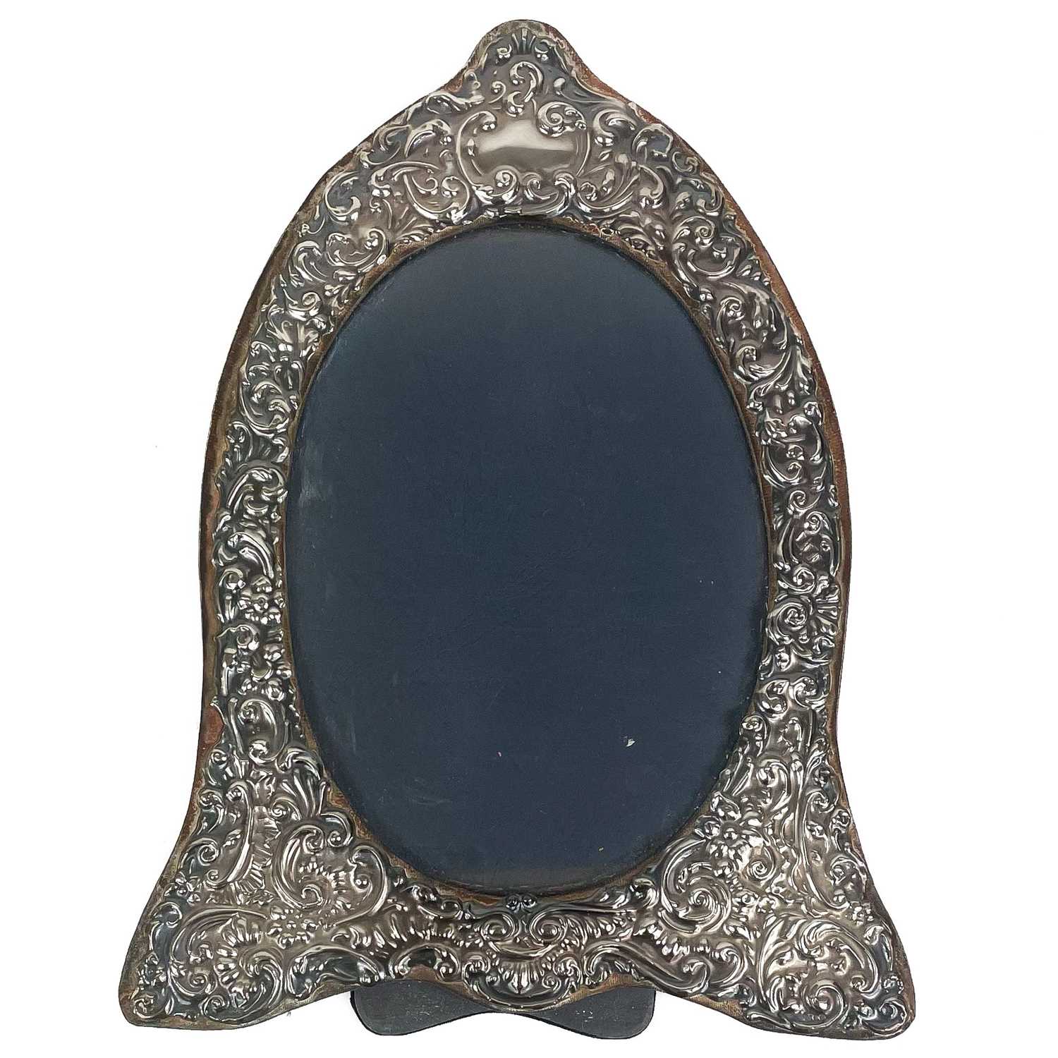 Lot 140 - A modern silver applied oval photograph