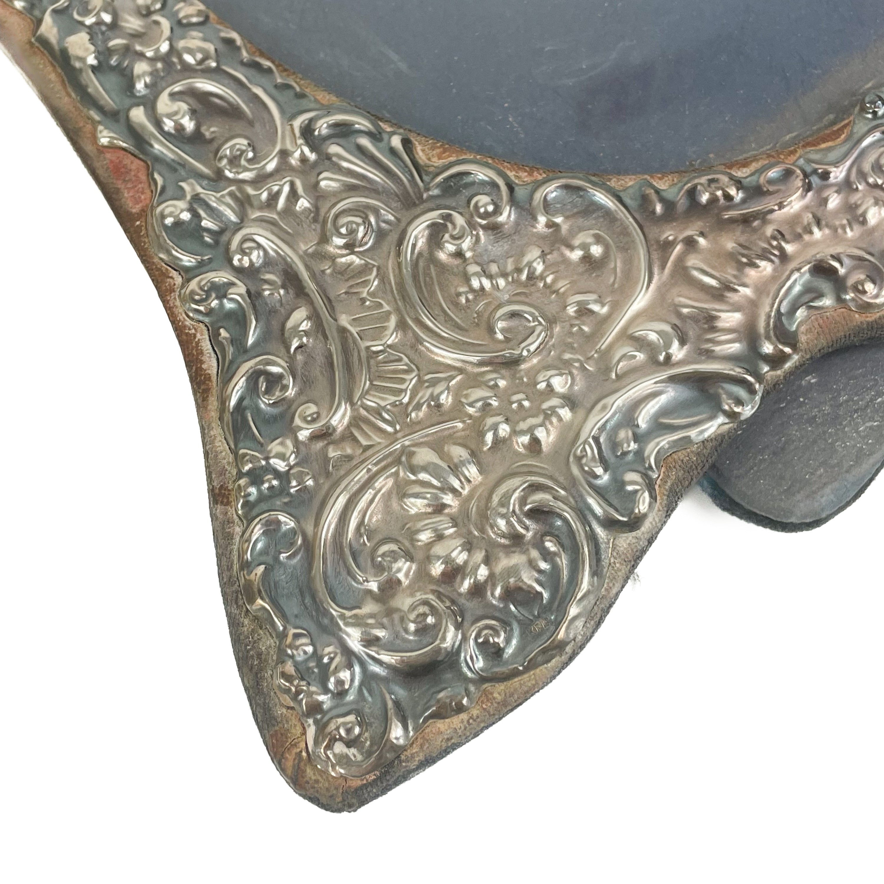 Lot 140 - A modern silver applied oval photograph