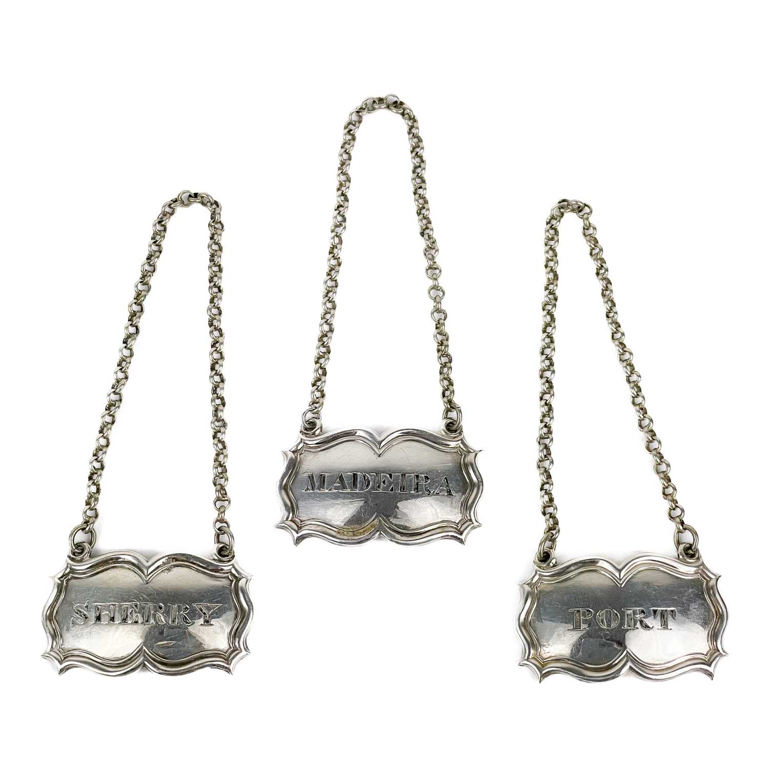 Lot 417 - A set of three William IV silver wine labels