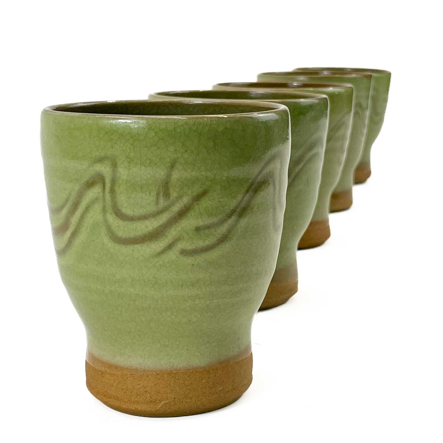 Lot 862 - Five studio pottery celadon yunomi cups with
