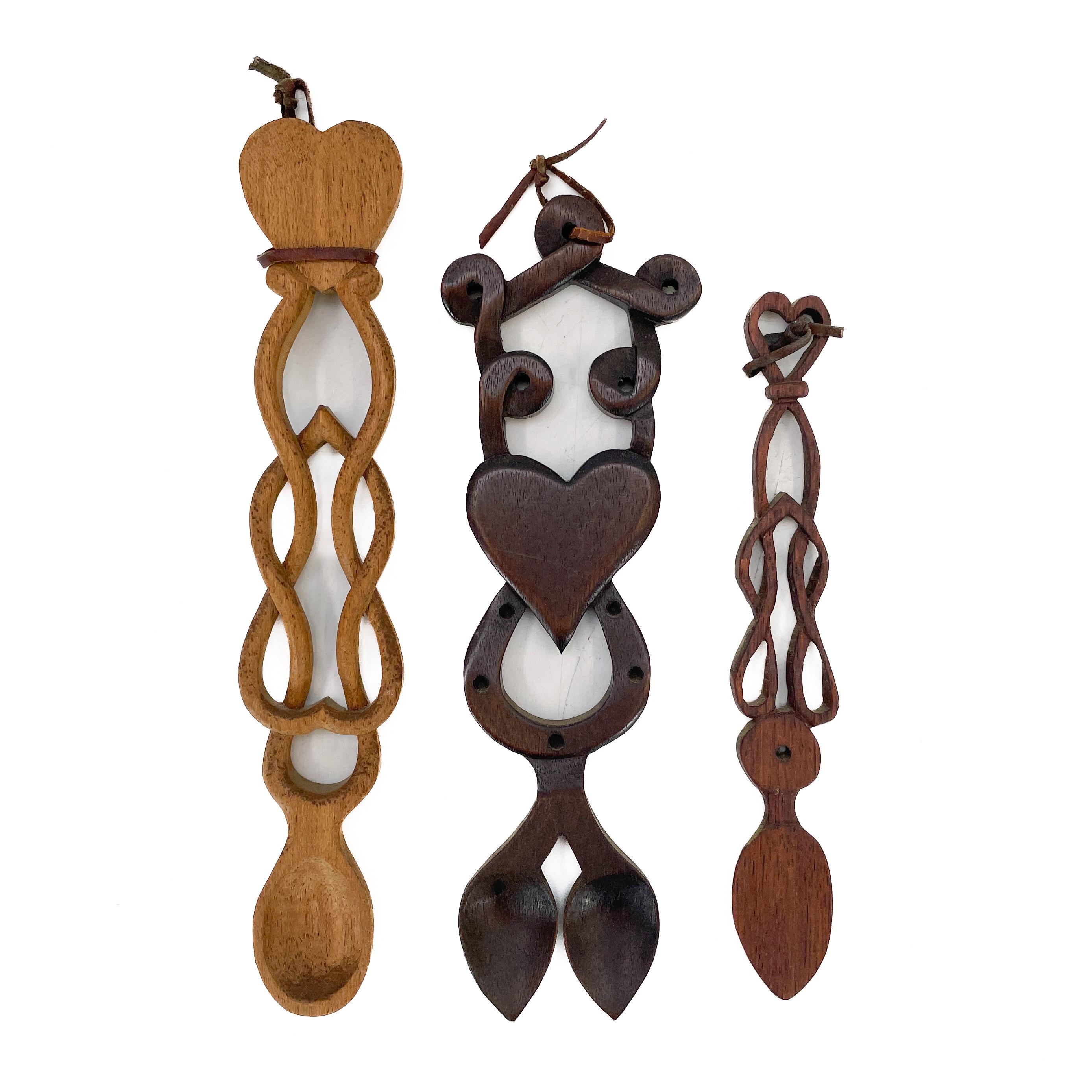 Lot 78 - A collection of nine Welsh love spoons.