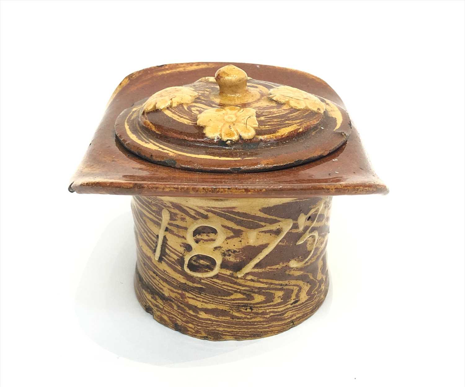 Lot 355 - A 19th century treacle glaze tobacco jar in